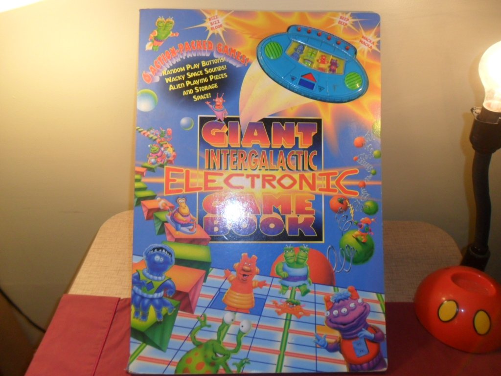 1997 Giant Intergalactic Electronic Game Book 6 Action Packed Games (SOLD)