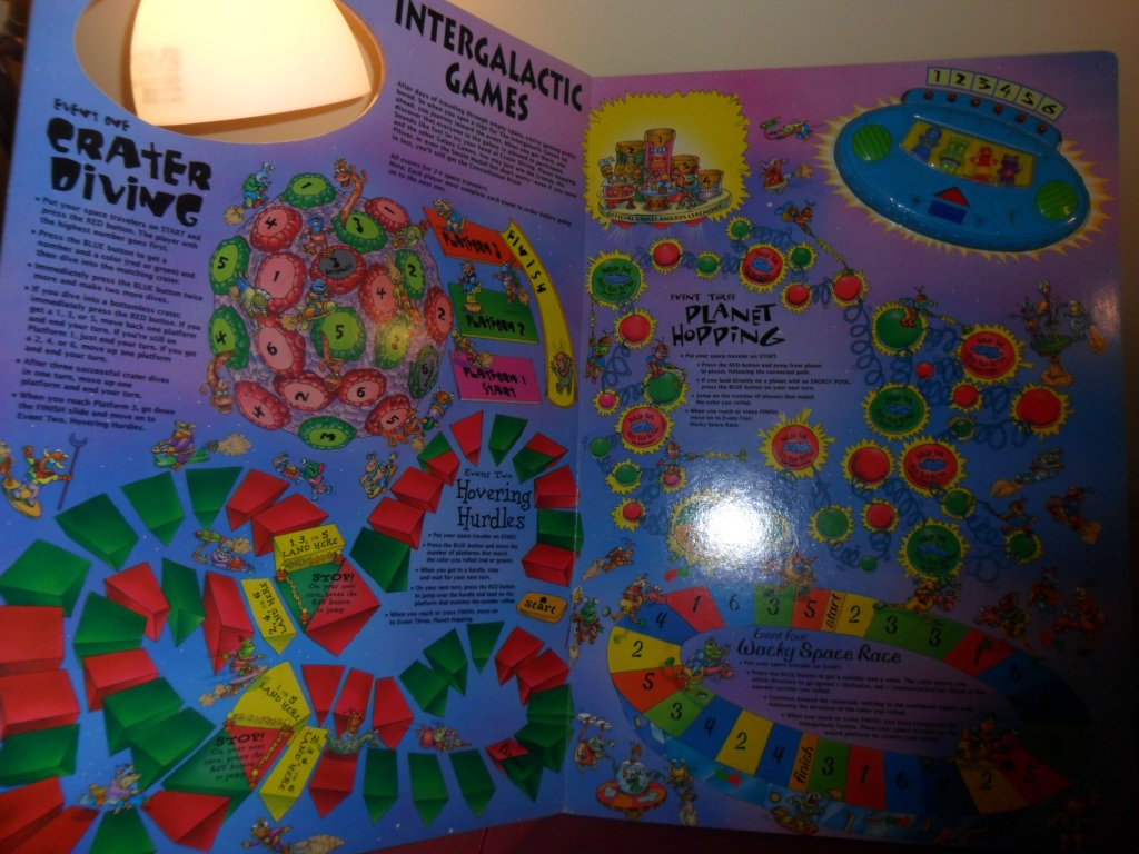 1997 Giant Intergalactic Electronic Game Book 6 Action Packed Games (SOLD)
