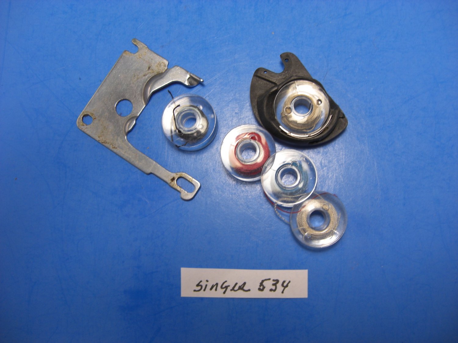 Singer 534 Apollo Bobbin Case + Five Bobbins