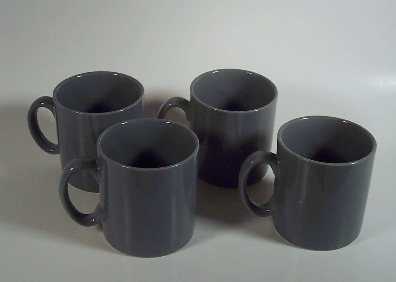 Set of 4 Mugs Gray with Flower Design accented with Shiny Gold Highlights
