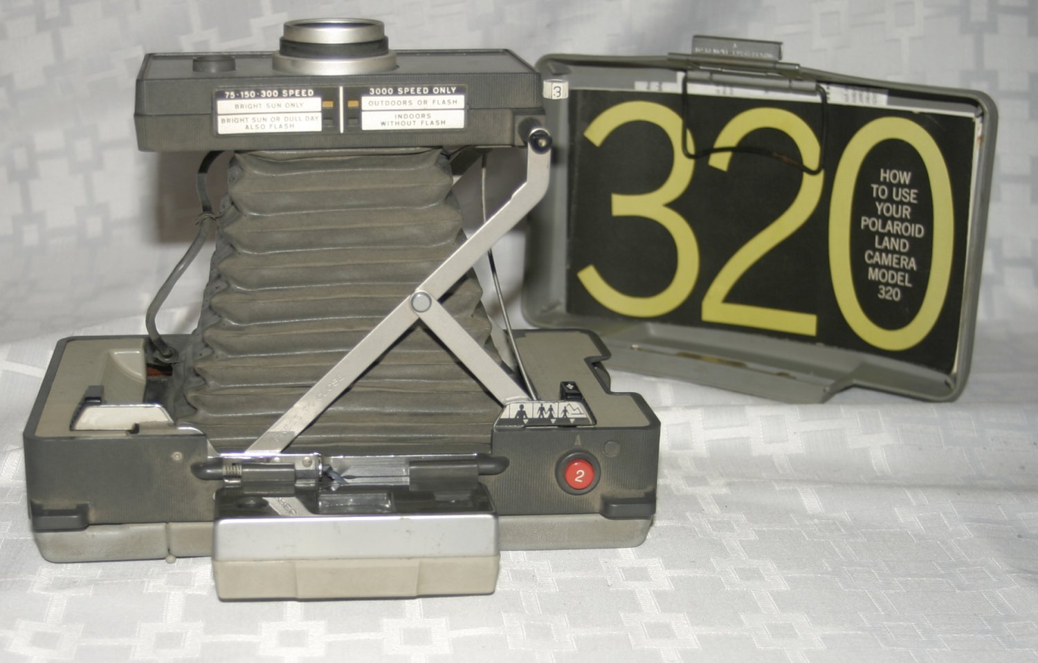 Polaroid 320 Instant Film Folding Land Camera tested works with book