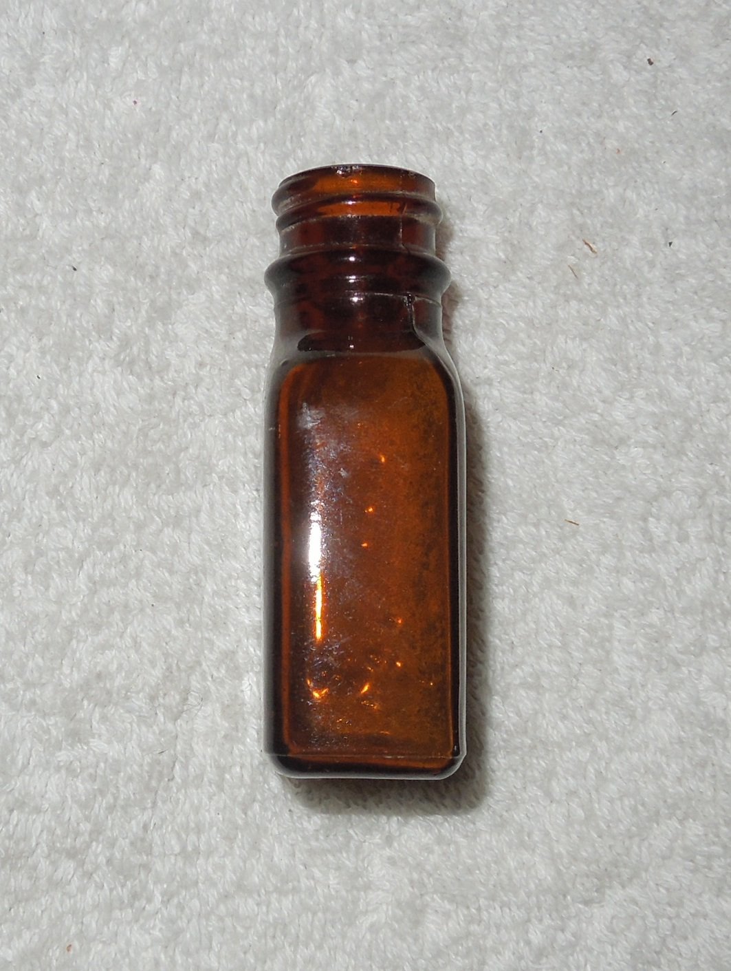 Small Rectangular Brown Glass Bottle - Embossed 18-S-B - Missing Cap ...