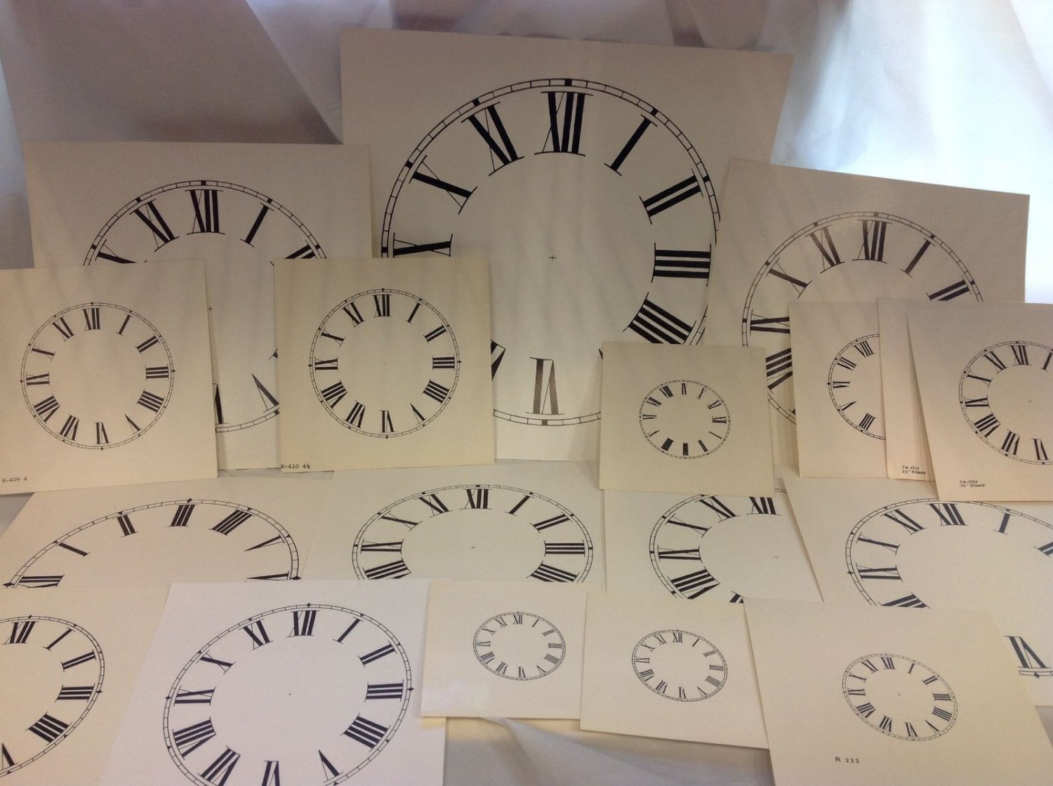 ~NEW~ 18 Assorted Paper Clock Dials-Off White Roman Numerals 2" to 11 ...