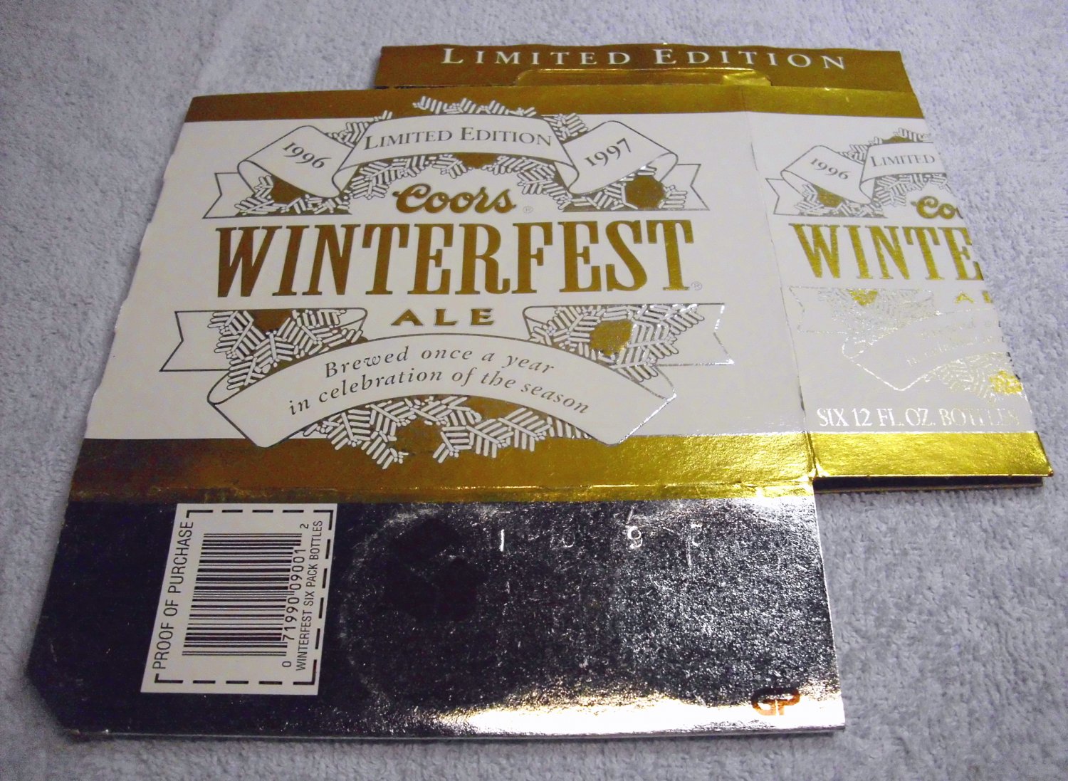 Coors Winterfest series 1987-1997 (8) beer bottles with one 6 pack carton.