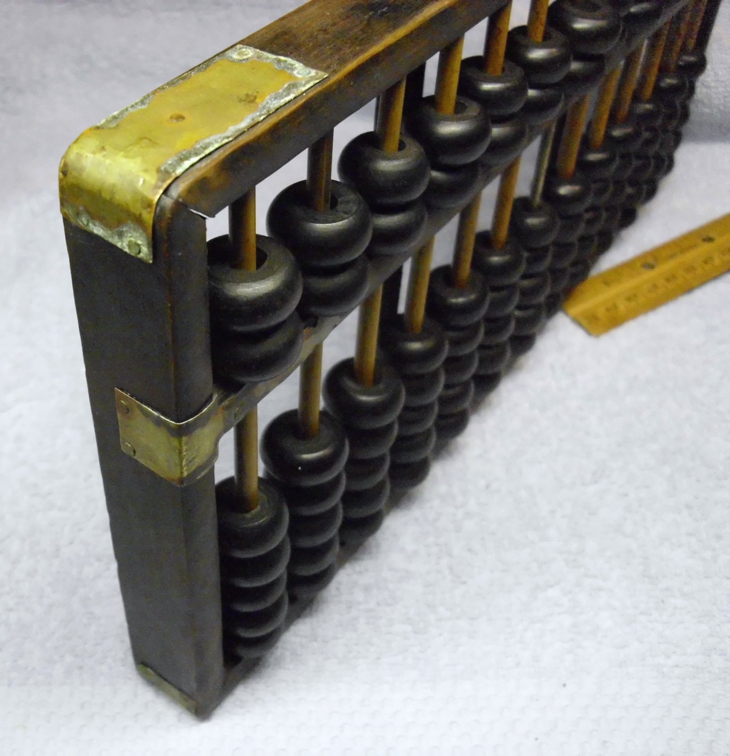 Abacus, pretty old, and original handmade, made of wood and brass.