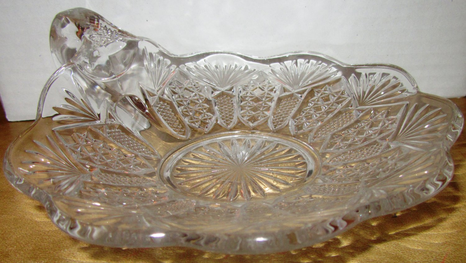 VINTAGE CUT GLASS CANDY DISH WITH FINGER LOOP HANDLE TEA CUP SAUCER