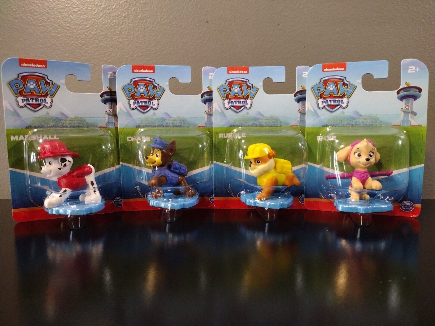 NEW 4 pack Paw Patrol pups Chase Rubble Skye Marshall badge characters ...
