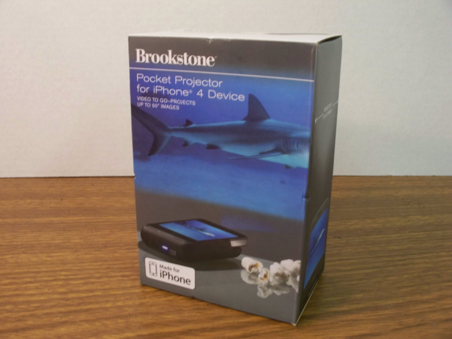 Brookstone Pocket Projector for iPhone 4 Device Projects up to 50 ...