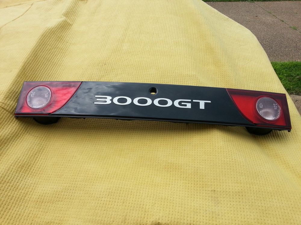Mitsubishi 3000GT reverse tail light / 3000GT logo plate. Black color