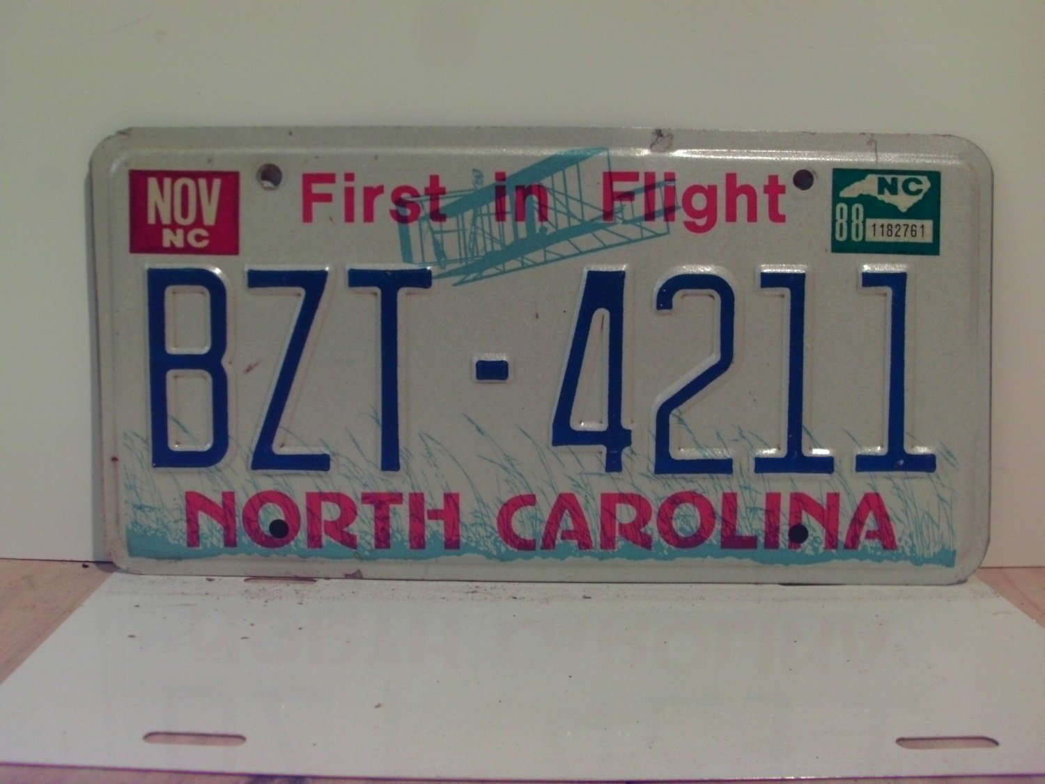 1988 North Carolina NC YOM First in Flight License Plate BZT-4211 WALL