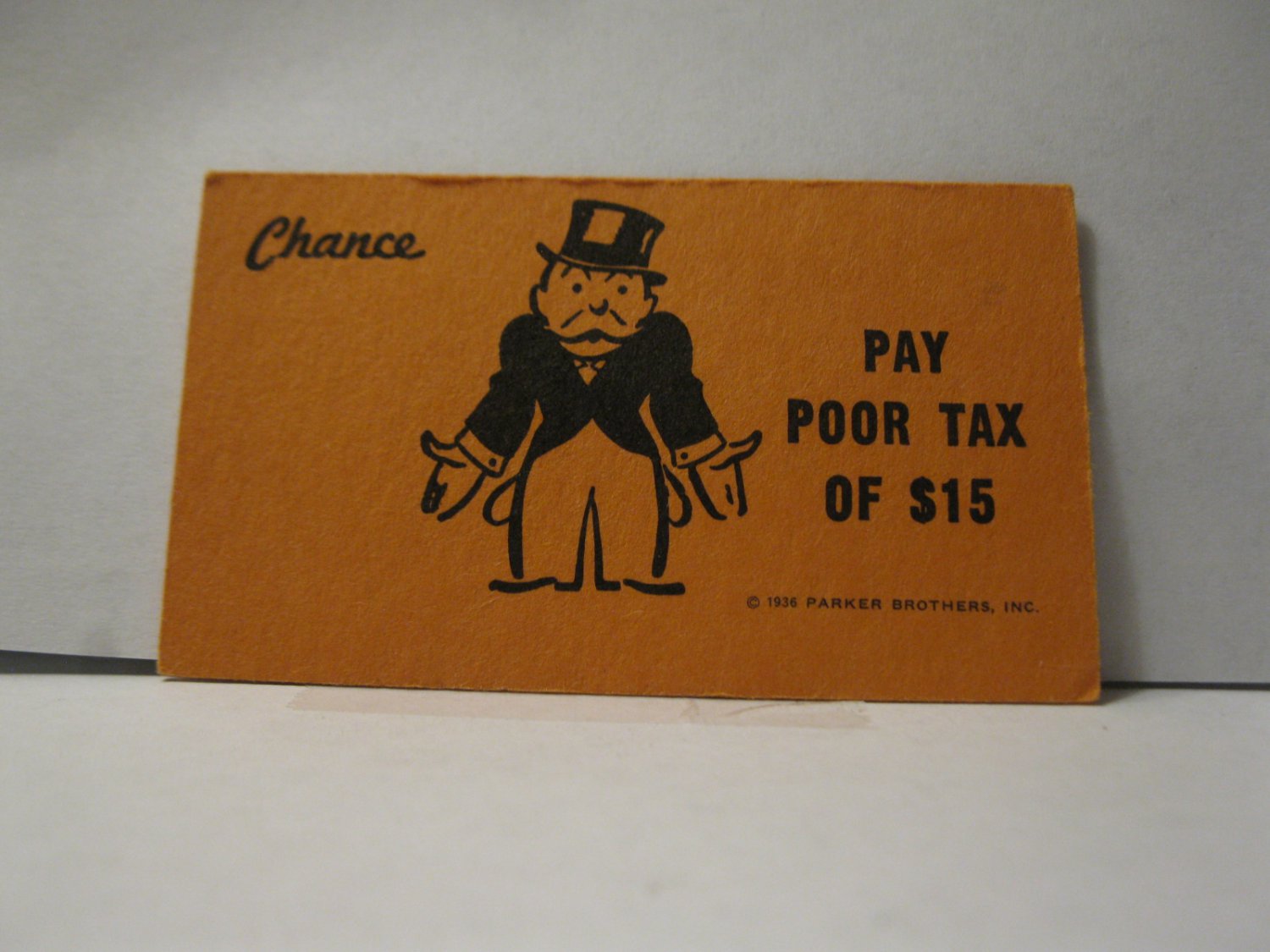 1985 Monopoly Board Game Piece: Pay Poor Tax Chance Card