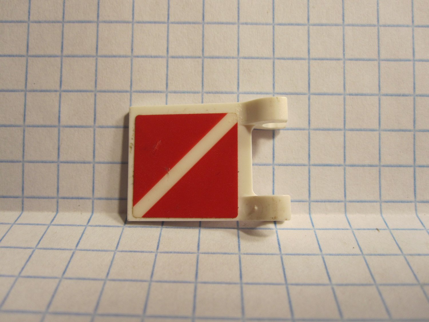 Lego part #2335pb146: 2x2 Square White Flag- 2 Red Triangles