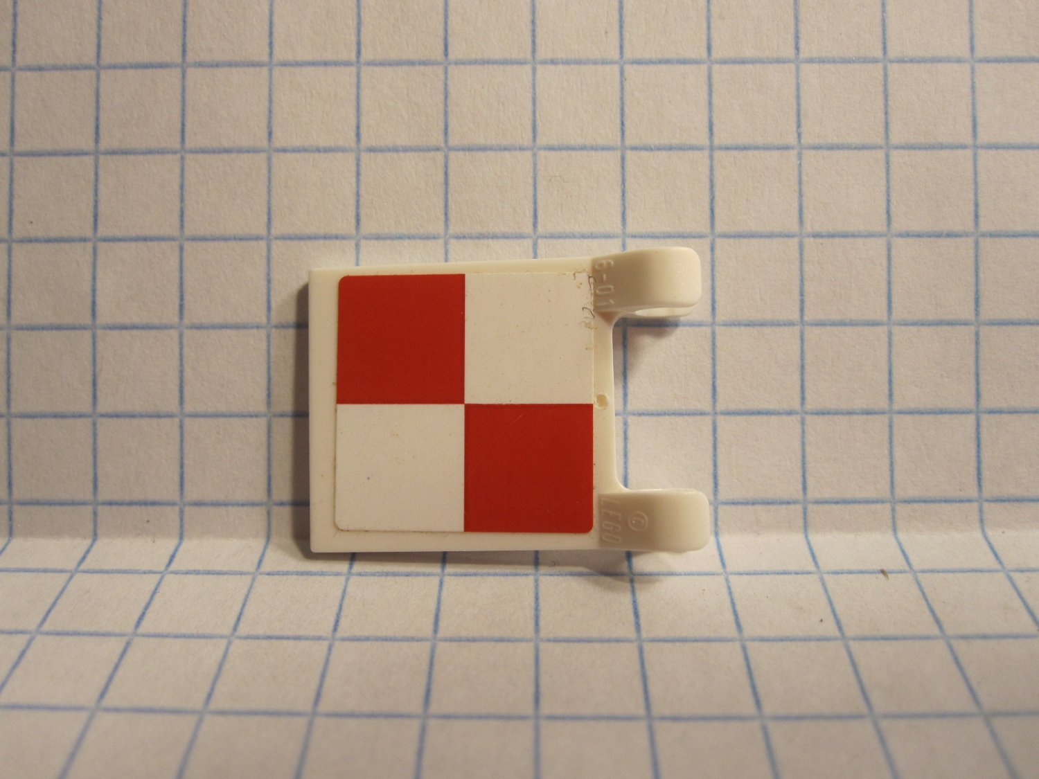 Lego part #2335pb026: 2x2 Square White Flag- Spongebob Red Checkered Flag