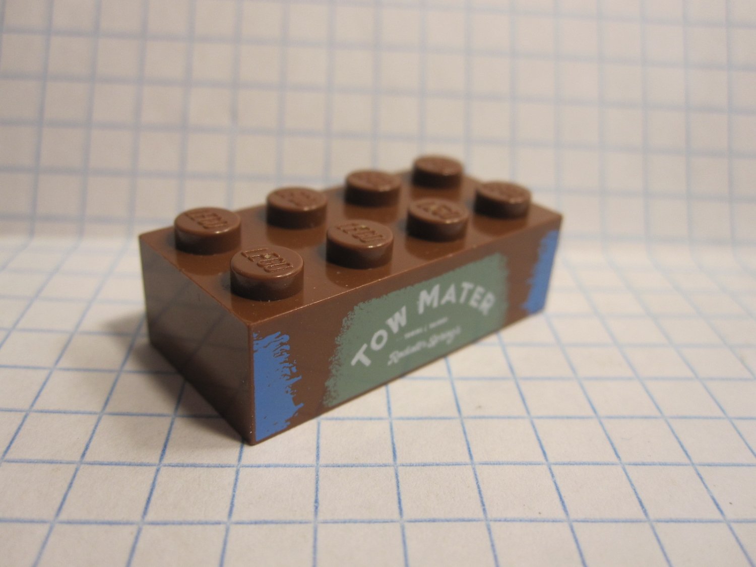 Lego part #3001pb081: 2x4 DBG Brick- Tow Mater sign