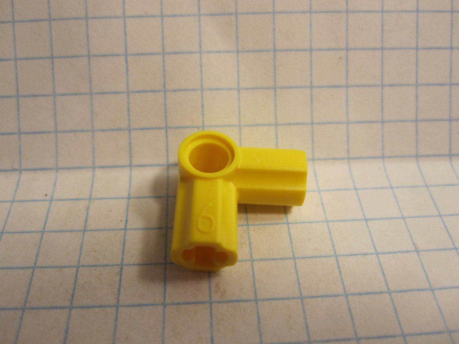 Lego Technic part #32014: Yellow- Angled Axle & Pin Connector, type 6