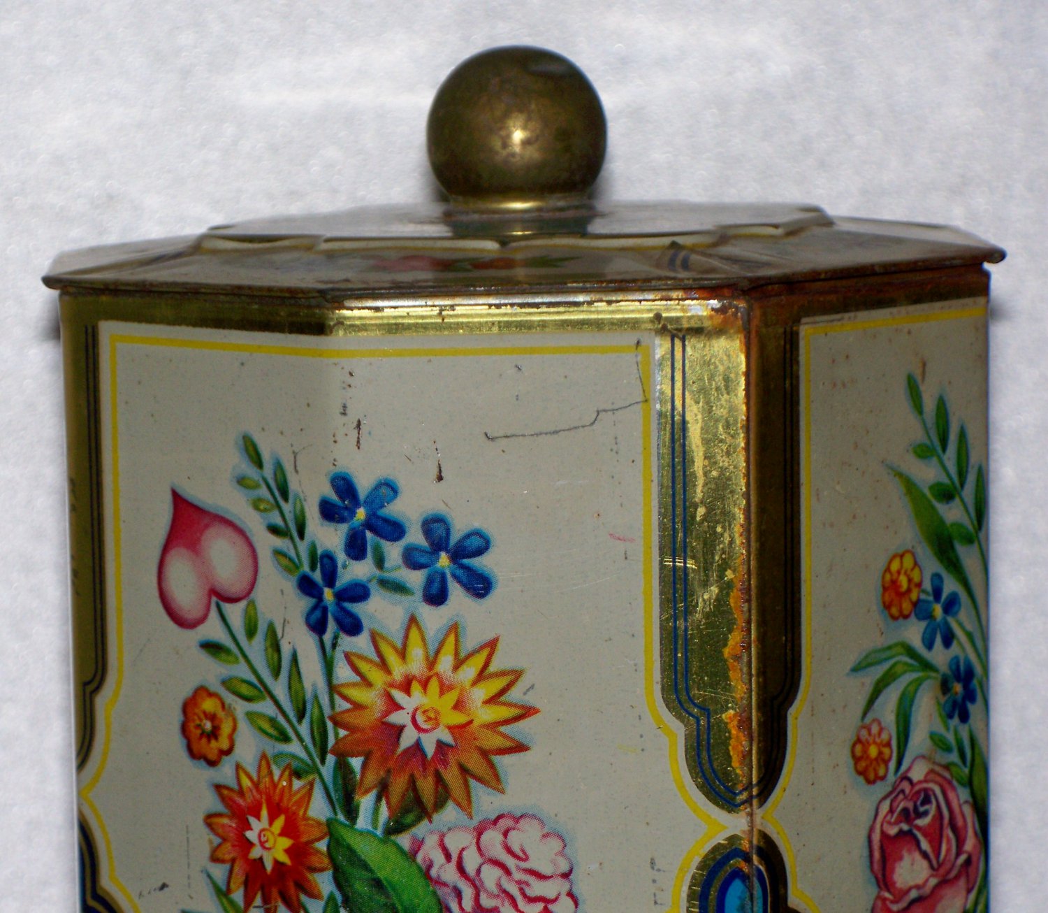 8 sided tin made in Western Germany with lid used and empty unknown maker