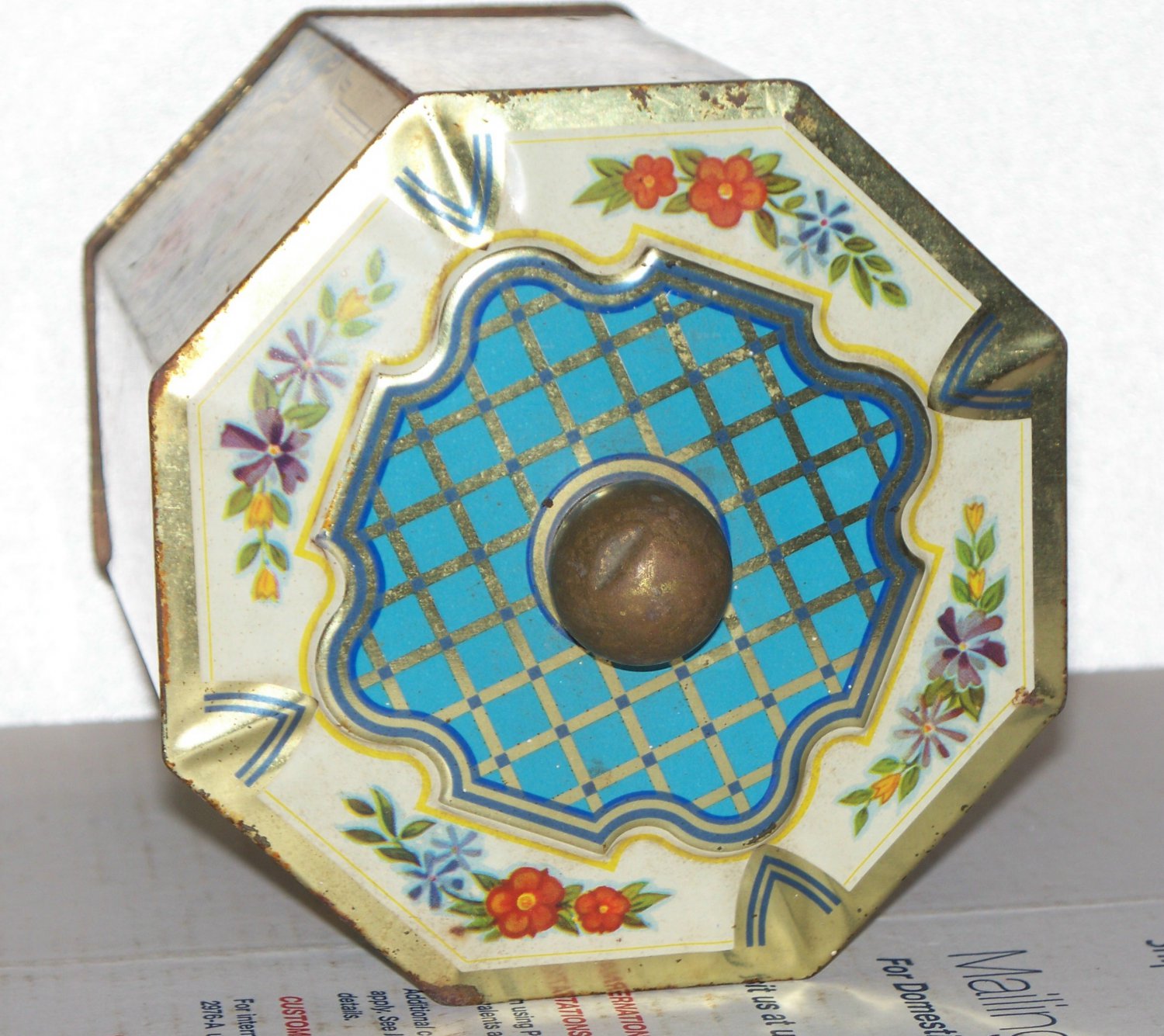 8 sided tin made in Western Germany with lid used and empty unknown maker
