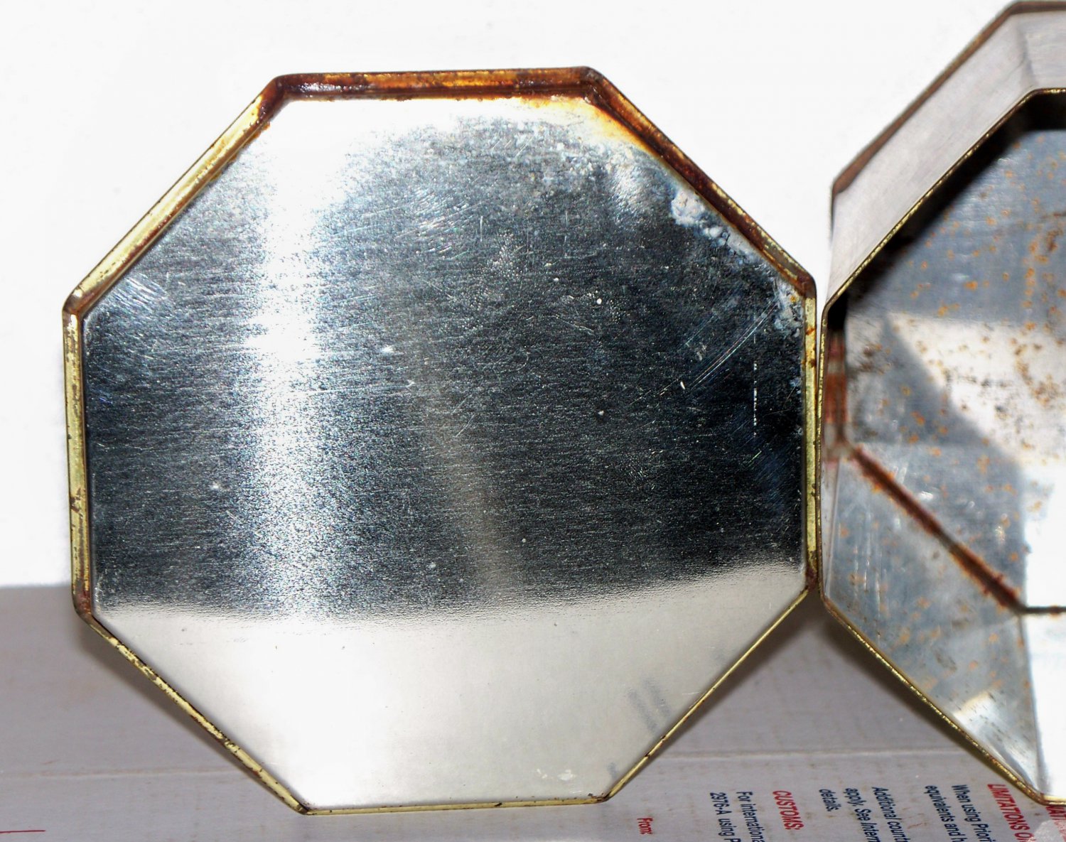 8 sided tin made in Western Germany with lid used and empty unknown maker