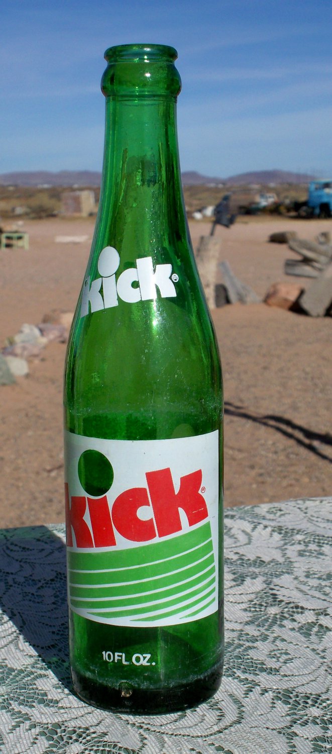 Kick green bottle citrus or soda no city on bottom 10 ounce used and empty