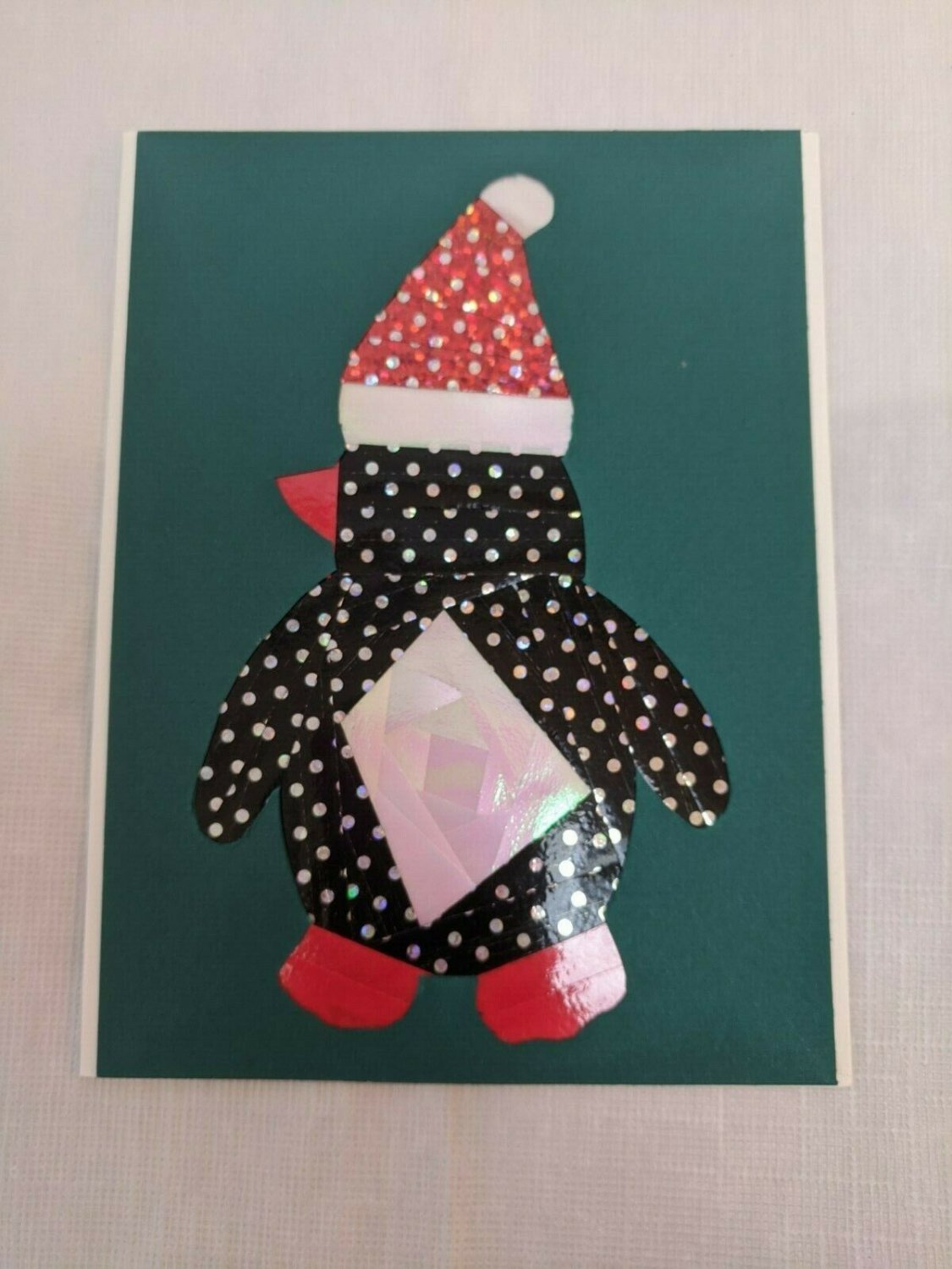Christmas Holiday Card PENGUIN - picture made of shiny gift ribbon