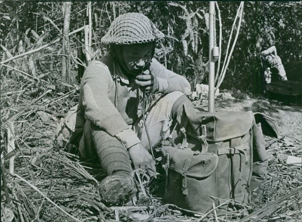 Chinese radio operator on the front lines in Northern Burma. - 8x10 photo