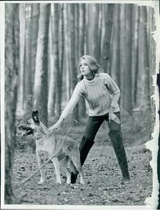 Jane Fonda with her dog. - 8x10 photo