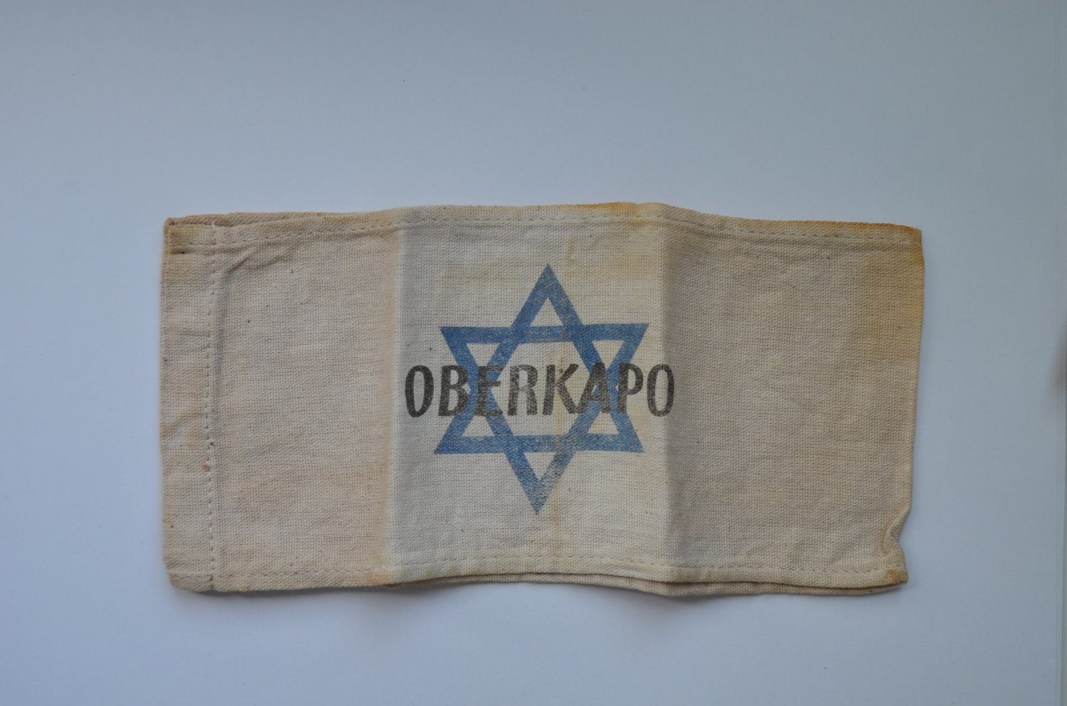 WWII THE JEWISH ARMBAND WITH THE CONCENTRATION CAMP OBERKAPO