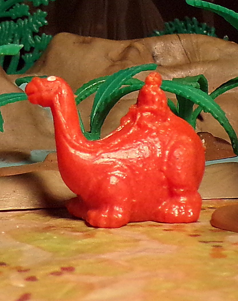 1987 Panosh (aka Dino Mites) Caricature #11 Orange Sauropod Rider (5-6-22)