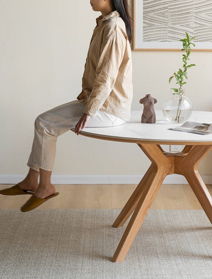 Round dining table with rock slab surface