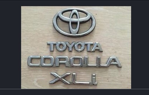 TOYOTA COROLLA XLI REAR BADGE LOGO EMBLEM SILVER 8.40cm X 5.70cm SET (B002)