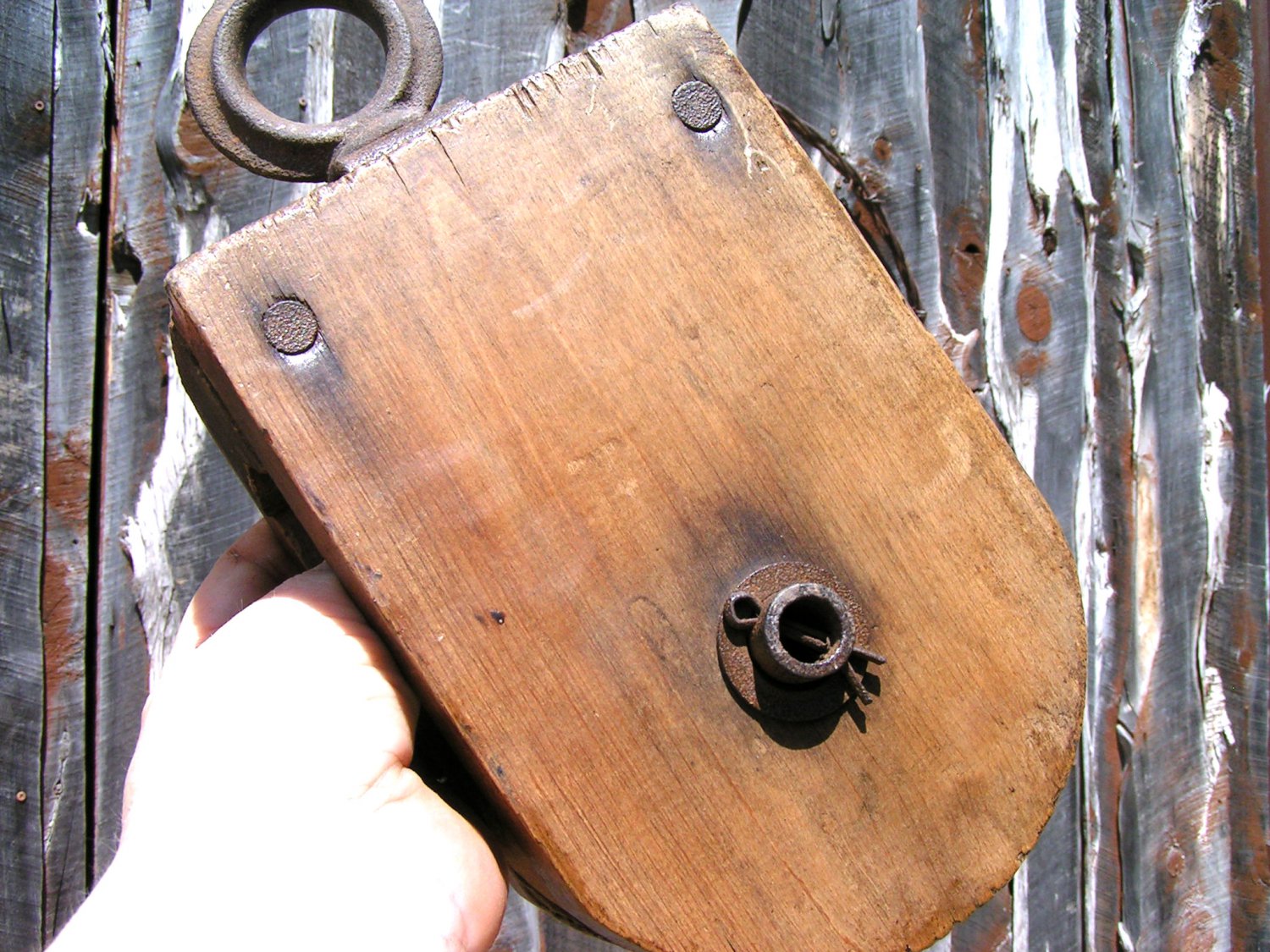 Old wooden rope pulley with wood wheel ec