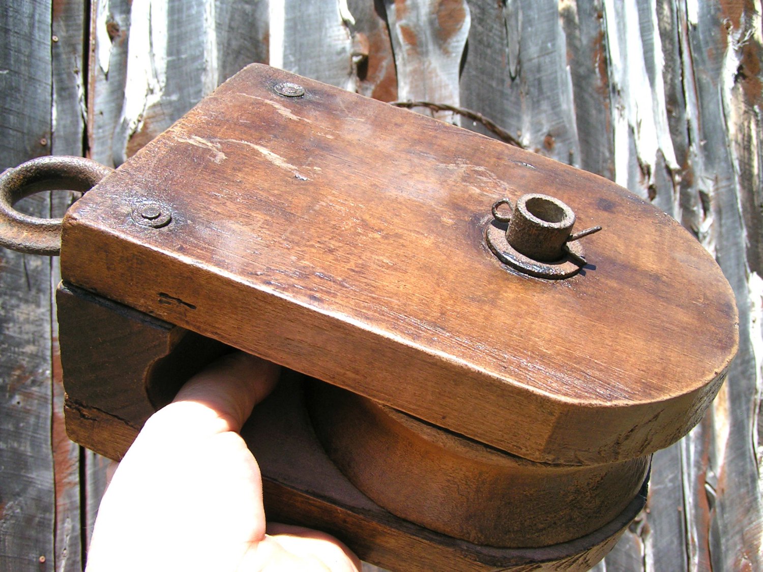 Old wooden rope pulley with wood wheel ec