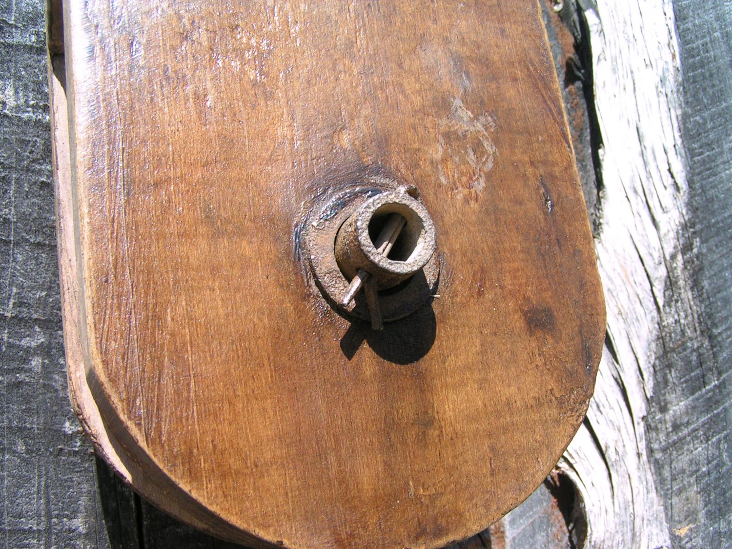 Old wooden rope pulley with wood wheel ec