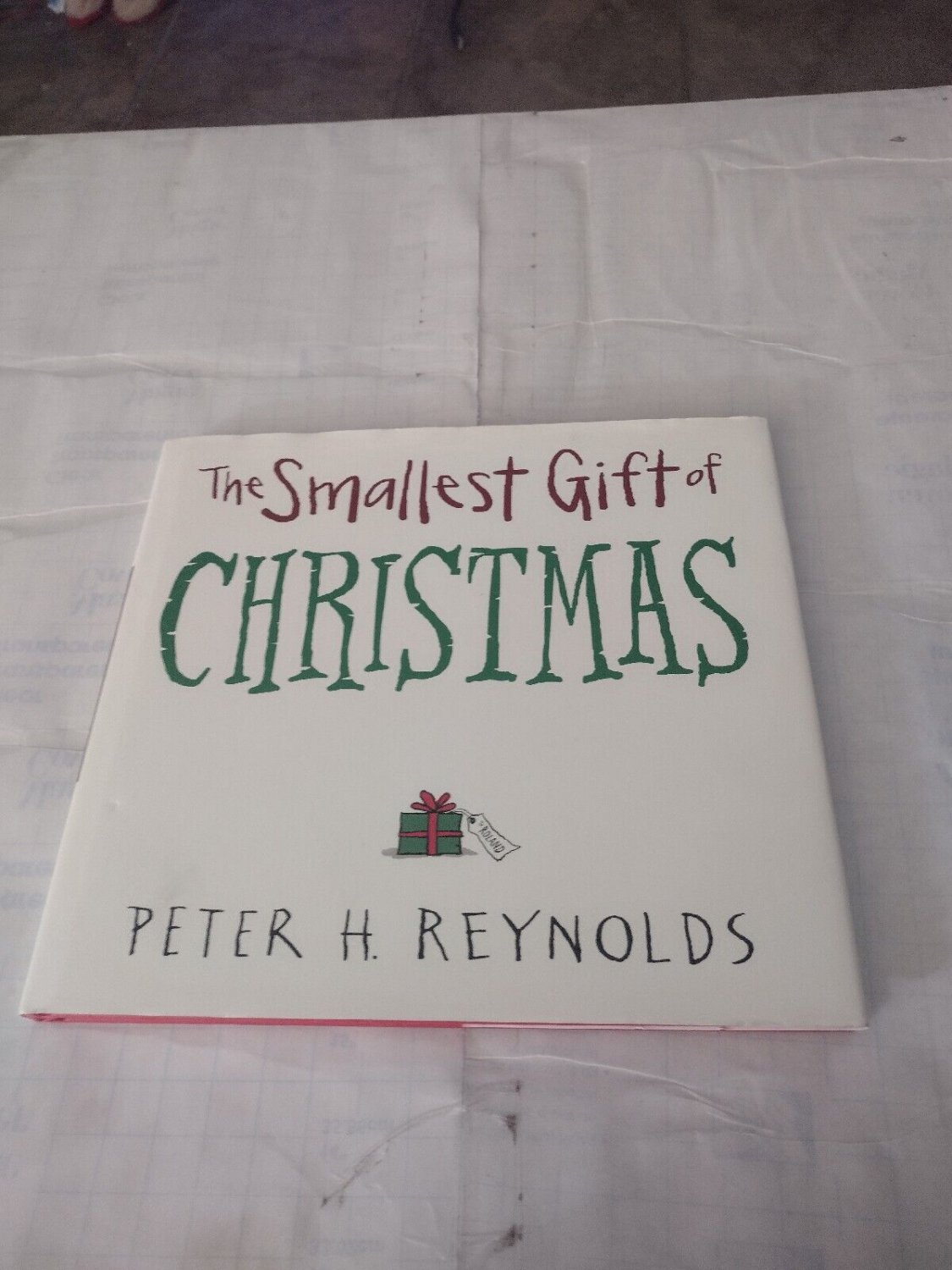 The Smallest Gift of Christmas by Reynolds, Peter H. Hard Cover Book!