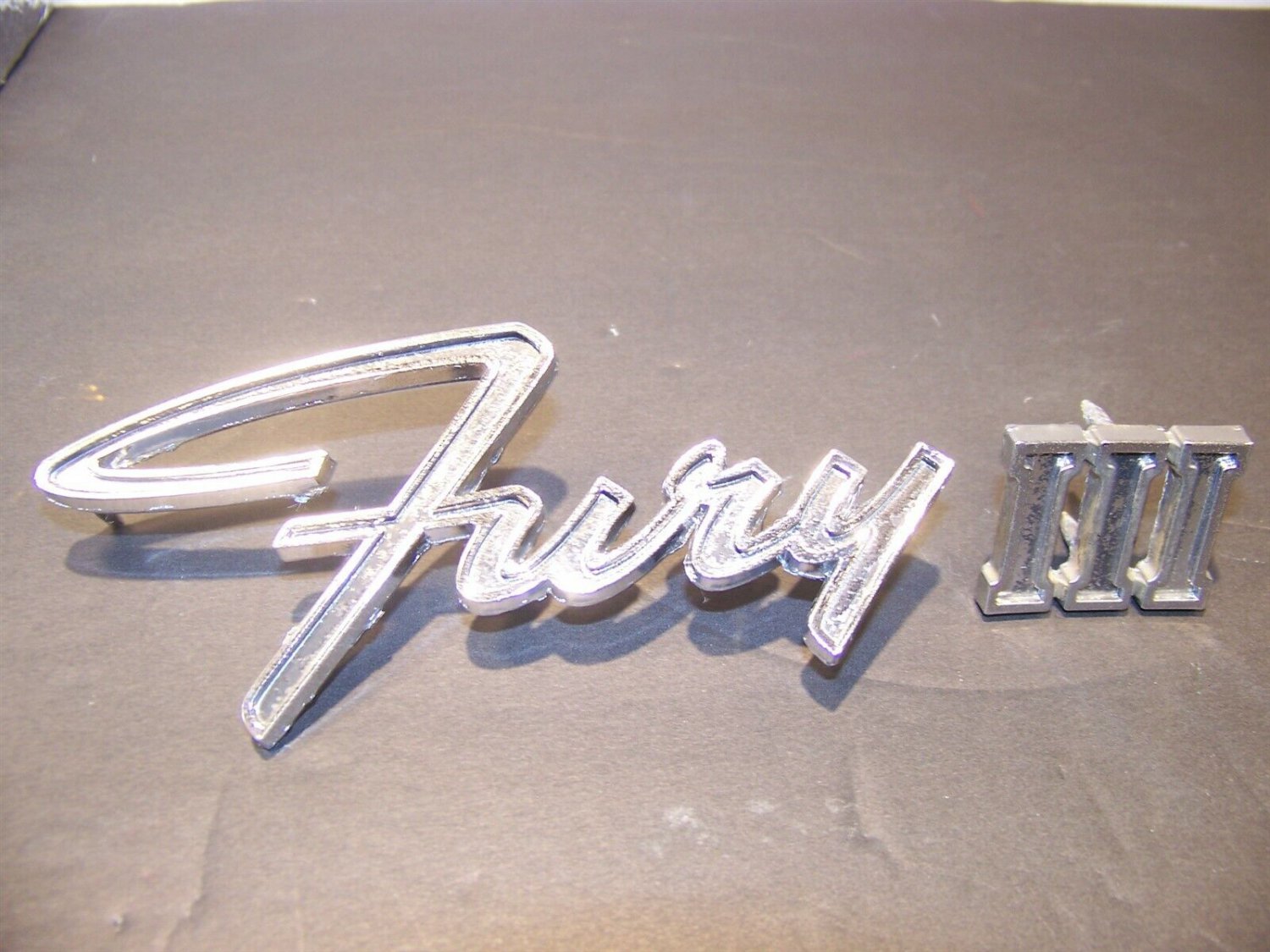 1965 Plymouth Fury III Fender Emblems OEM Pair 2524233 2524226
