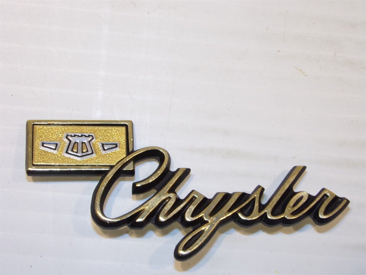 1970 's Chrysler Emblem OEM Gold 3 3/8" W x 1 1/2" H