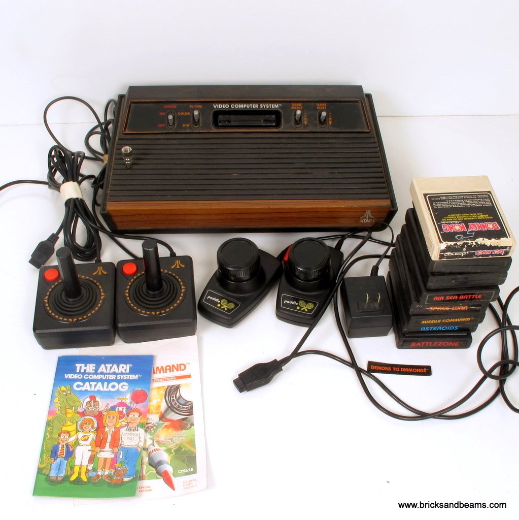 Atari 2600 Video Computer System w 8 Games 2 Joysticks Paddles CX-2600A