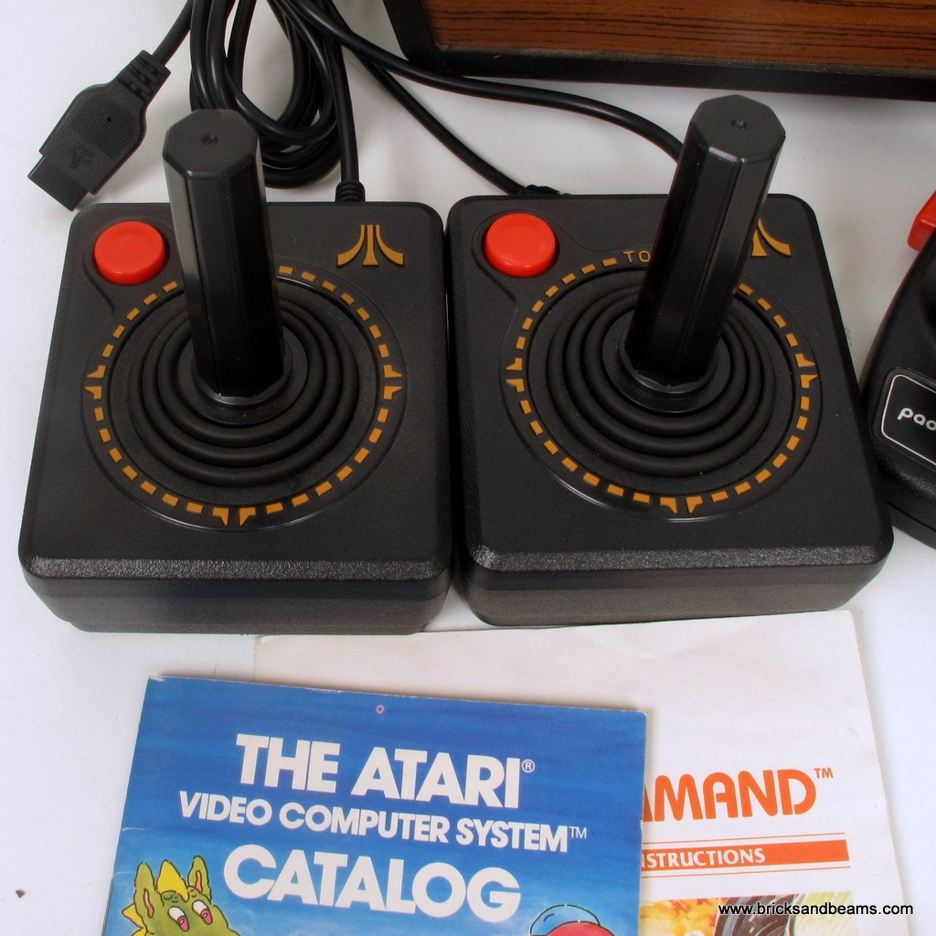 Atari 2600 Video Computer System w 8 Games 2 Joysticks Paddles CX-2600A