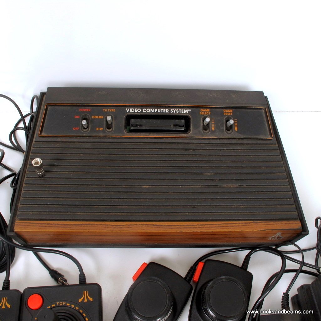 Atari 2600 Video Computer System w 8 Games 2 Joysticks Paddles CX-2600A