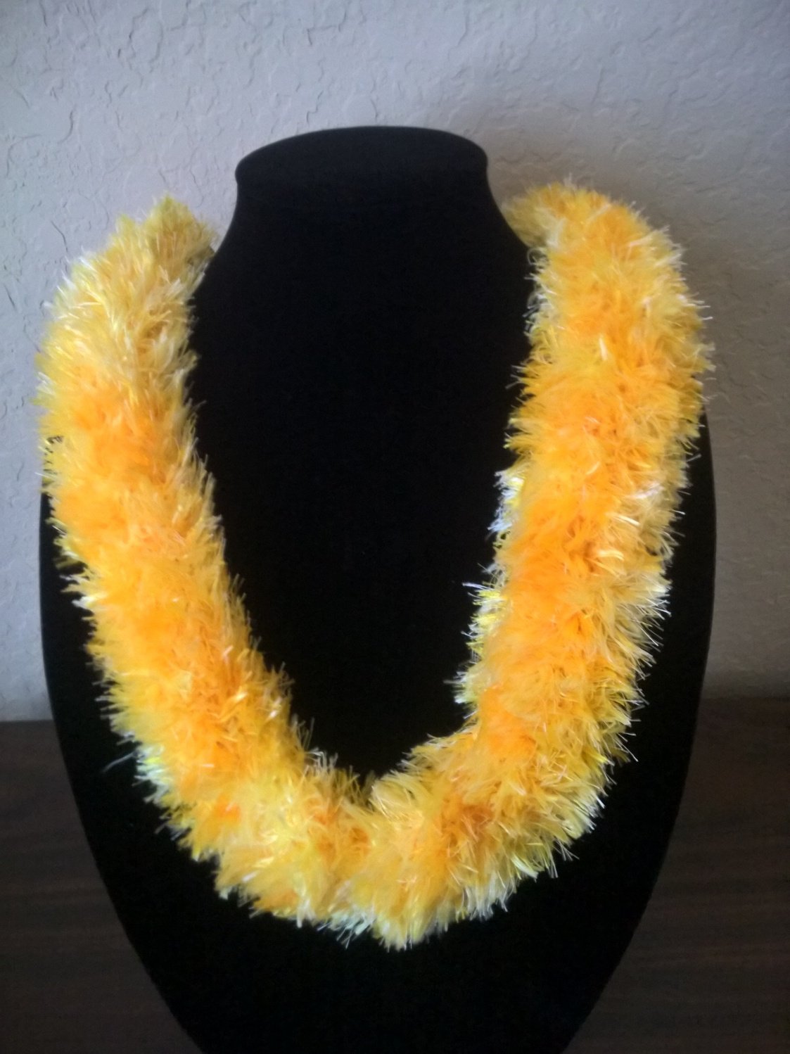 Hawaiian lei hat band knit w/ yellow multi-color eyelash yarn