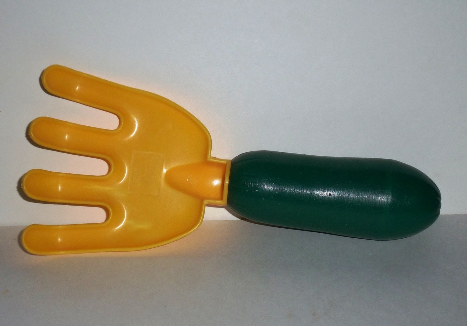 Green & Yellow Plastic Toy Garden Hand Rake Loose Used